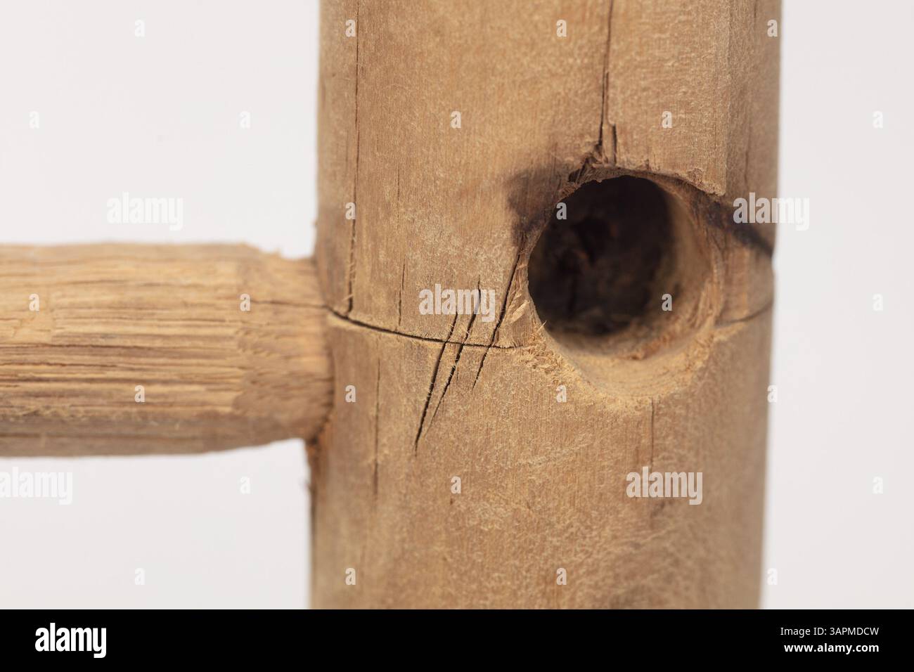 This incomplete hickory wood side chair has a slat-back design and peg ...