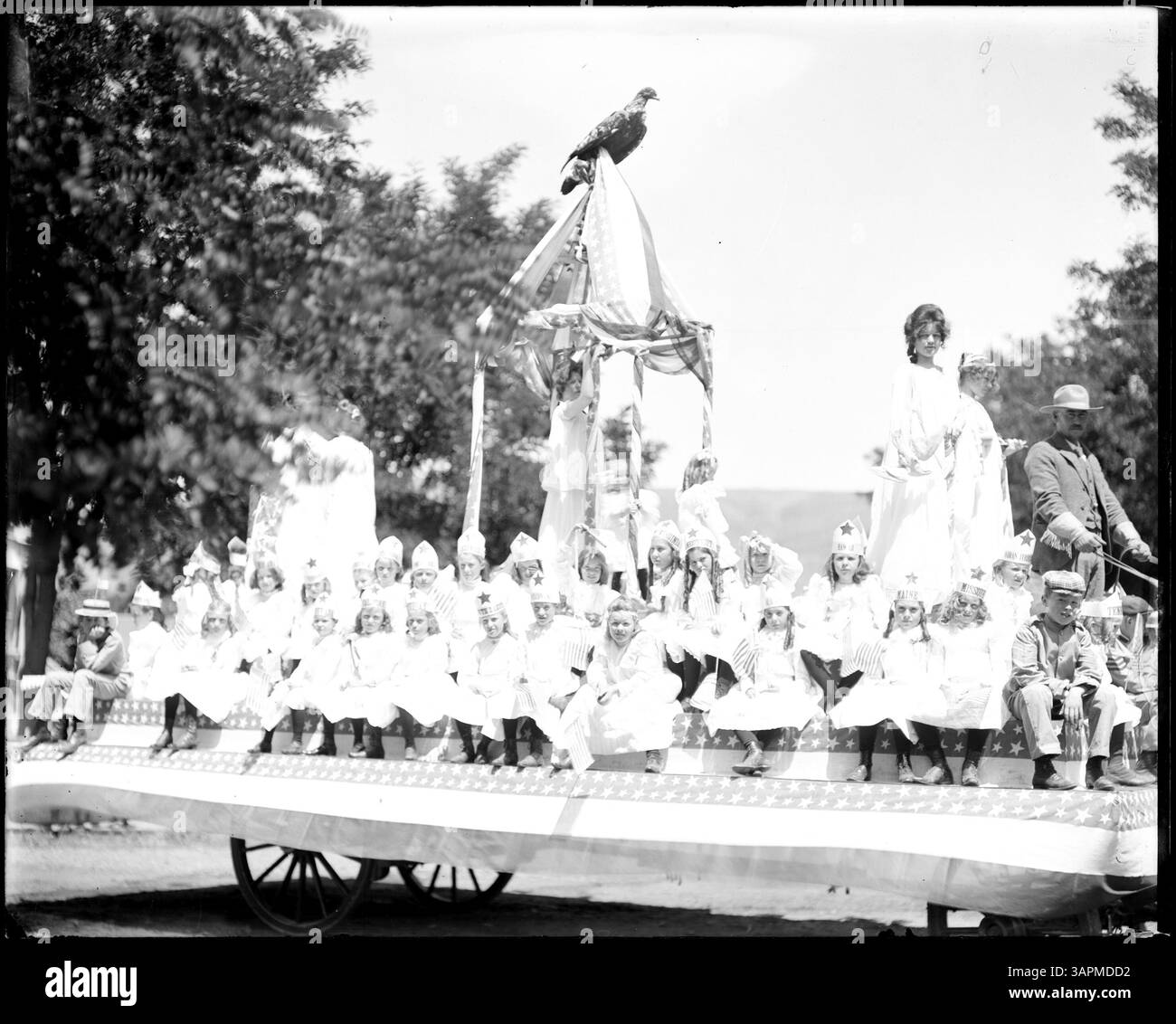 A photograph of children on a Fourth of July parade float representing ...