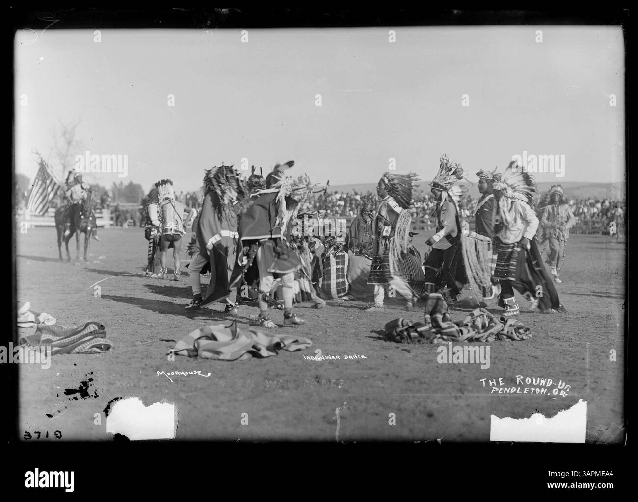 This photograph captures tribal dances during a roundup, showcasing ...