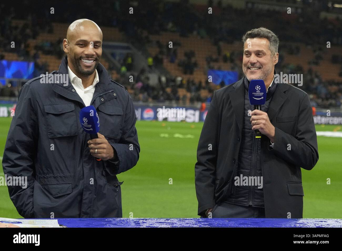 Former soccer players, Julio Cesar, right, and Maicon gesture during an ...