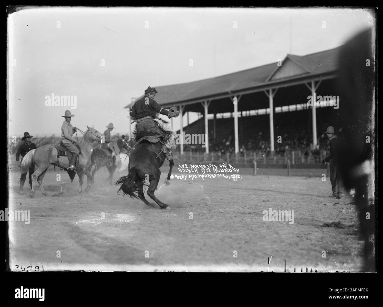 W.E. Mahaffey is photographed on a bucking horse, showcasing the ...