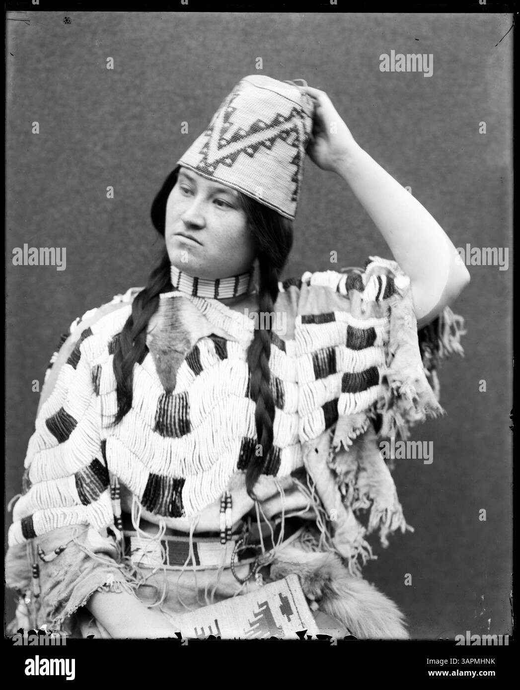 This photograph shows Esther Umahollis, an Umpqua tribal woman, wearing ...