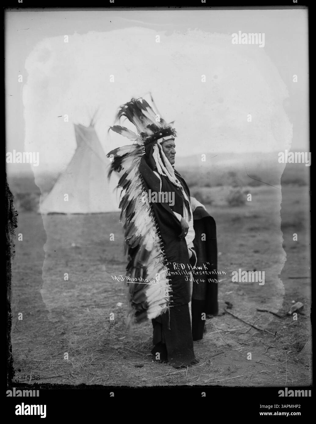 This photograph shows George Red Hawk, a Cayuse tribal man, dressed in ...