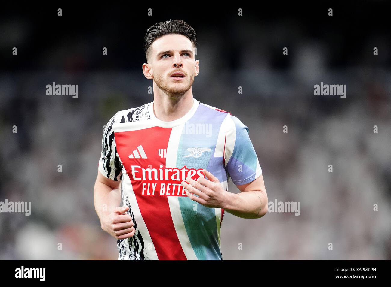 Arsenal's Declan Rice warms up ahead of the UEFA Champions League ...