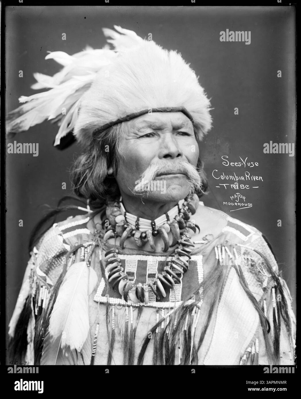 This photograph depicts Sees-yuse, a Columbia River Indian, adorned in ...