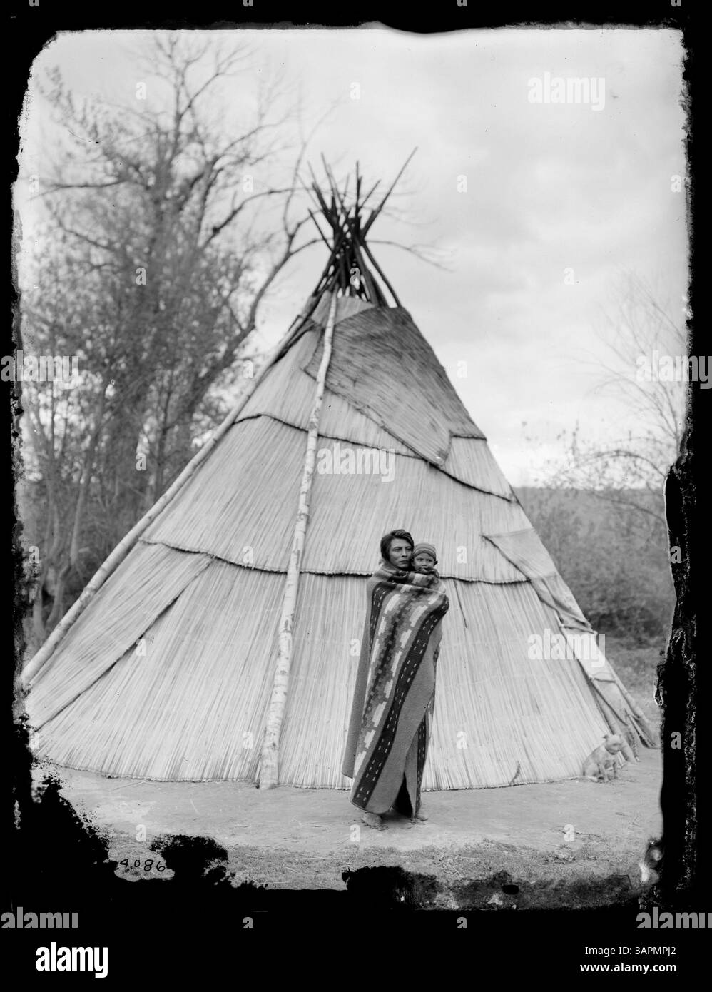 This photograph features Victor William, a Cayuse Indian, standing ...