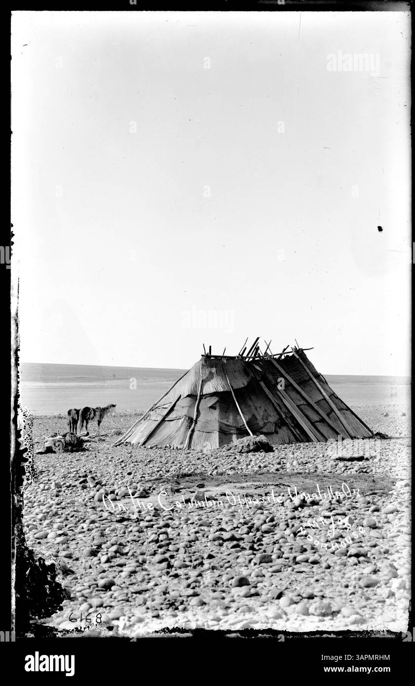 This photograph by Lee Moorhouse depicts tribal camps located on the ...