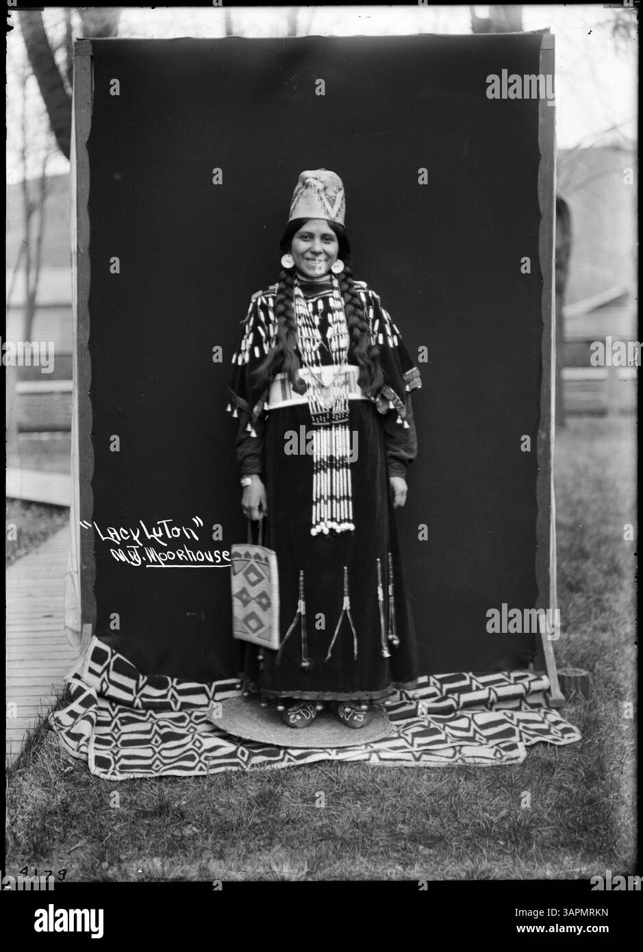 A portrait of Lacy Luton, a Cayuse Indian, dressed in traditional ...