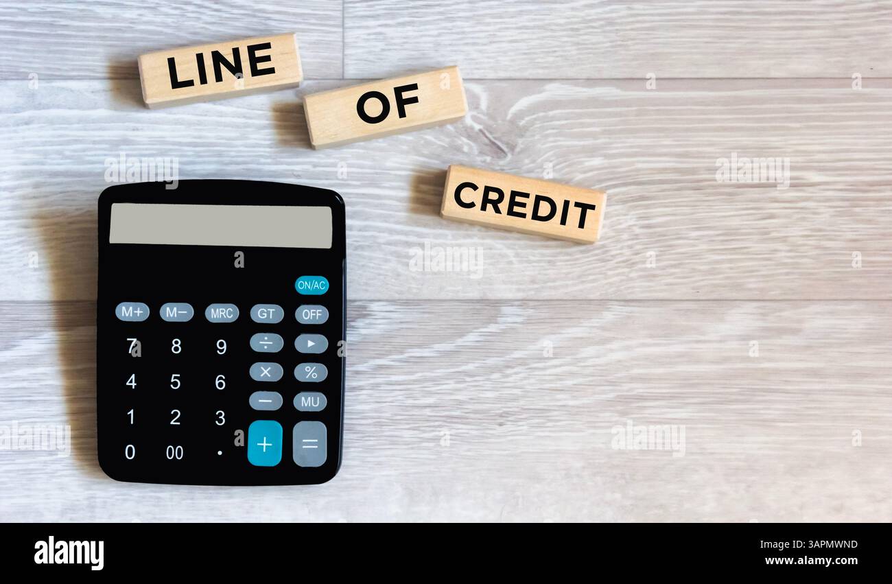 On the desktop there is a calculator and wooden blocks with the ...