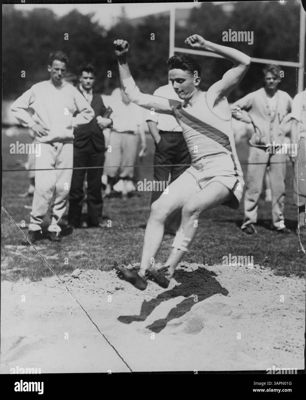 Ray Burge competing in the broad jump event for Central Neighborhood ...