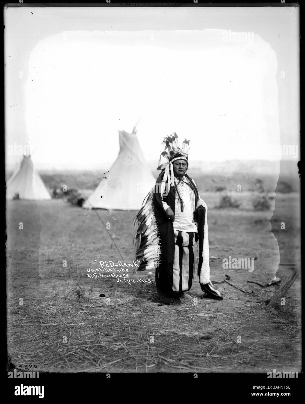 George Red Hawk, a Cayuse tribal man, is photographed in his camp with ...