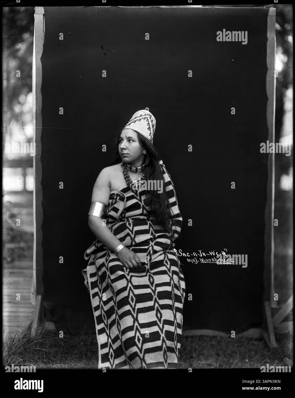 Lee Moorhouse’s photograph features several tribal women dressed in regalia, symbolizing ...