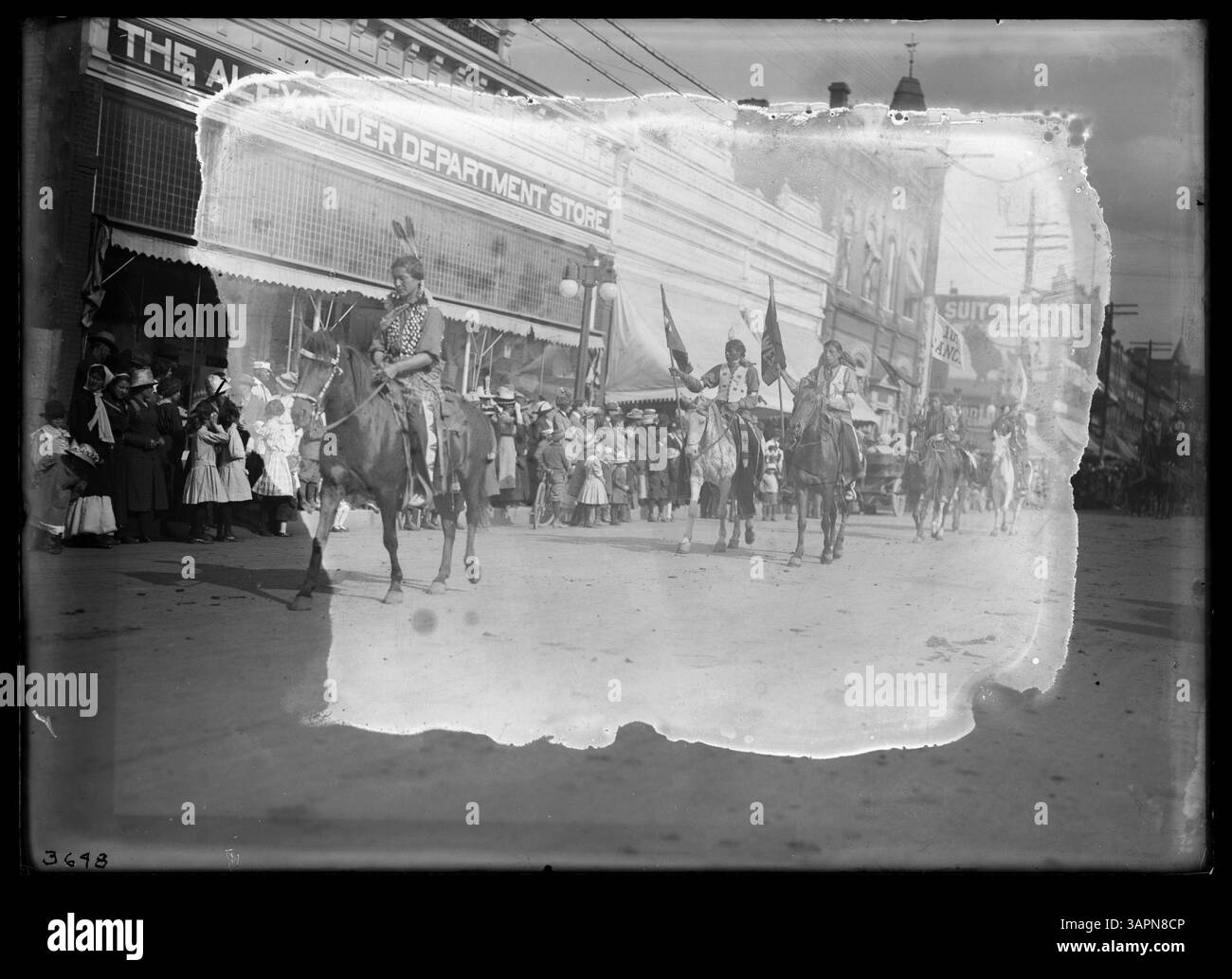 The photograph shows a roundup parade, capturing a festive gathering of ...