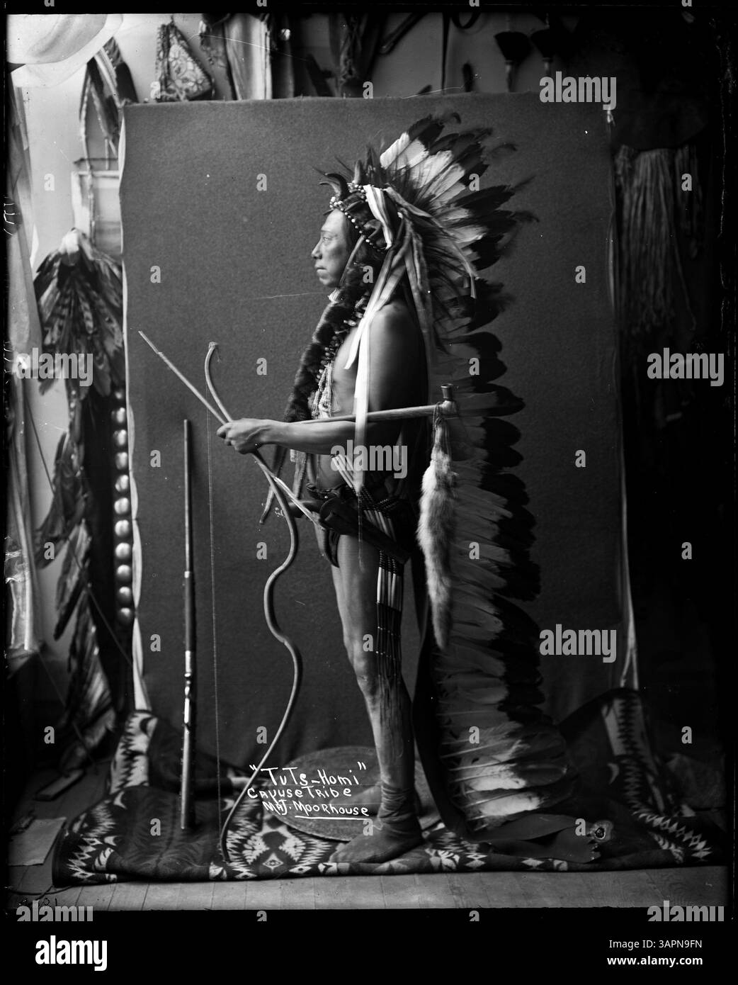 Photograph of Tats-homi, a Cayuse Indian, dressed in regalia, including ...