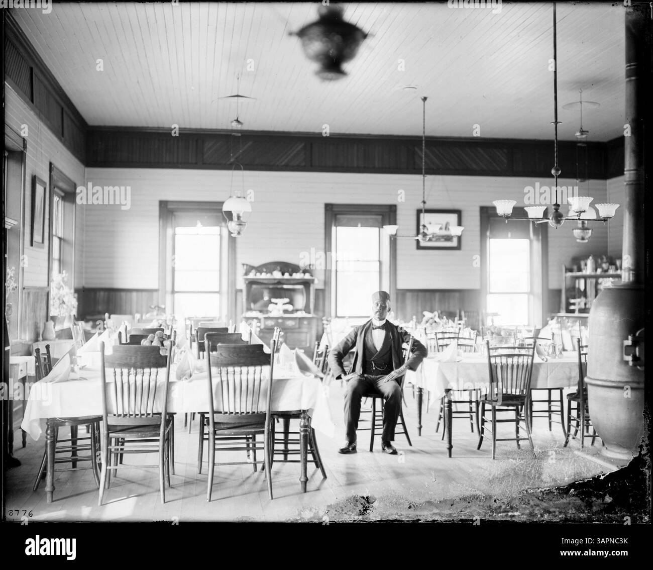 This photograph features the exterior and interior dining room of the ...
