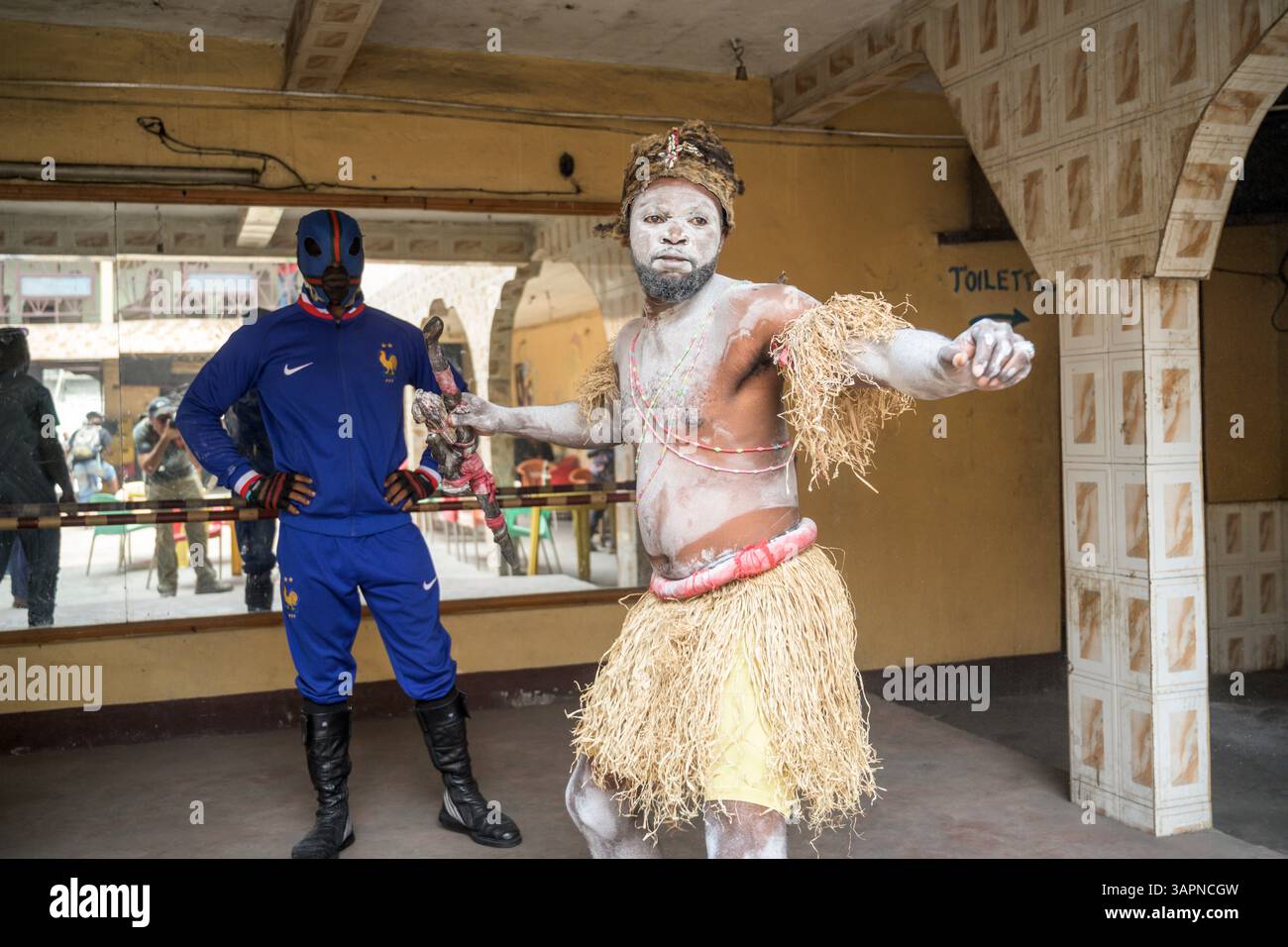 Catch Congolese wrestlers dressed in their fighting outfits posing ...