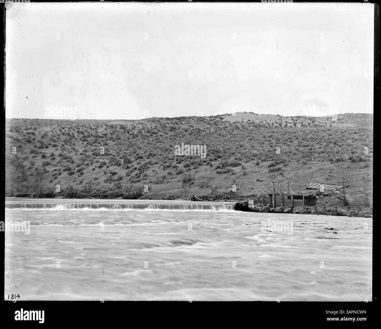 This photograph shows an irrigation dam, flume, and spillways on the ...