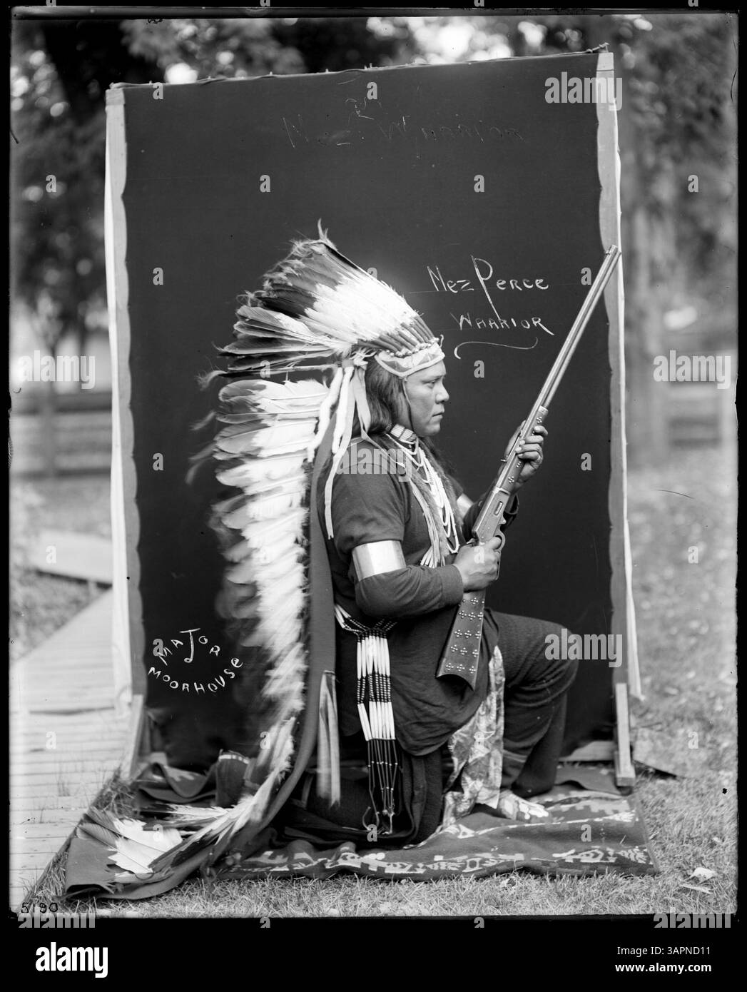 Portraits of a Nez Perce Indian wearing a war bonnet, shown in various ...