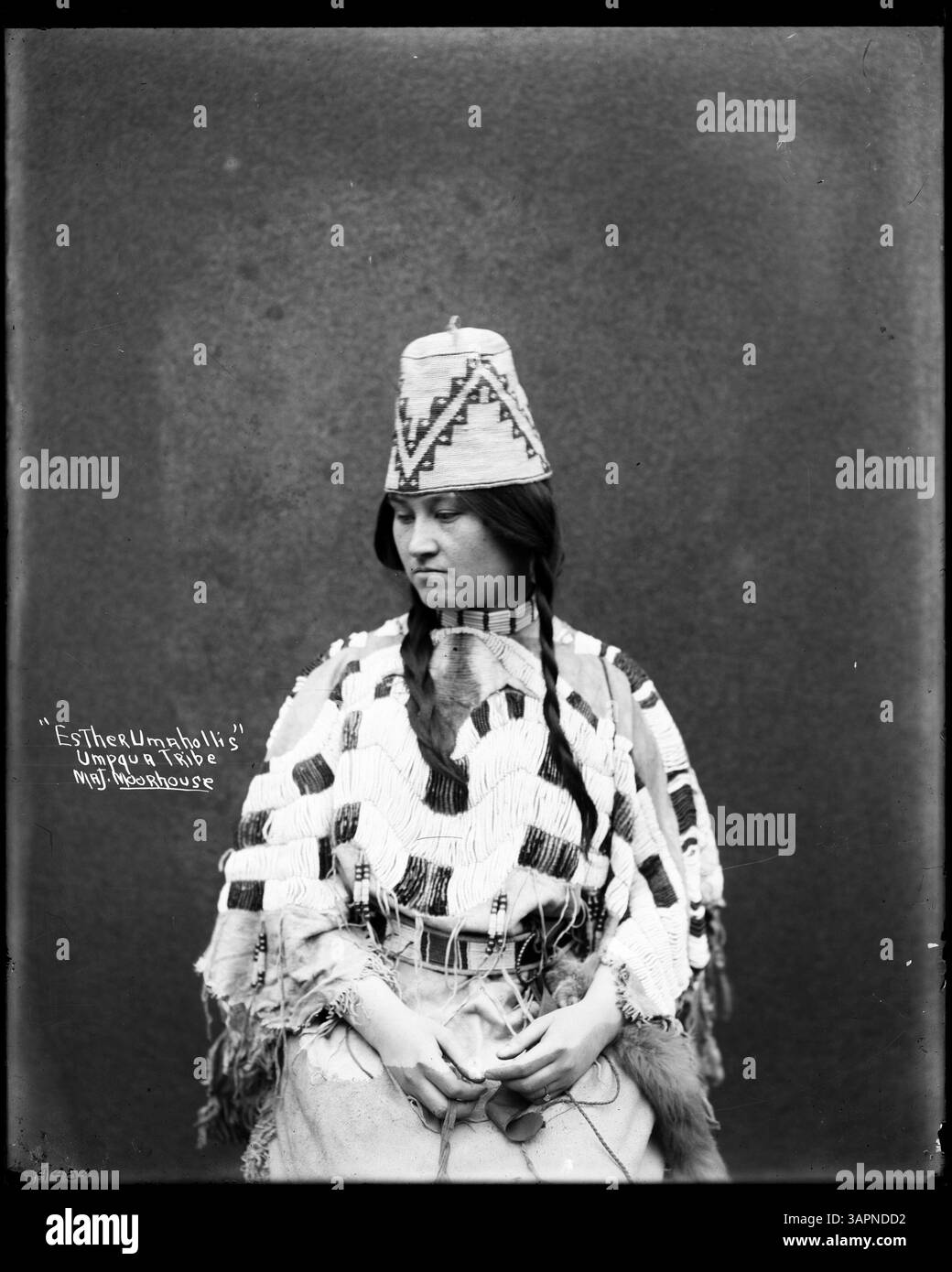 Photograph of Esther Umahollis, an Umpqua tribal woman, dressed in ...