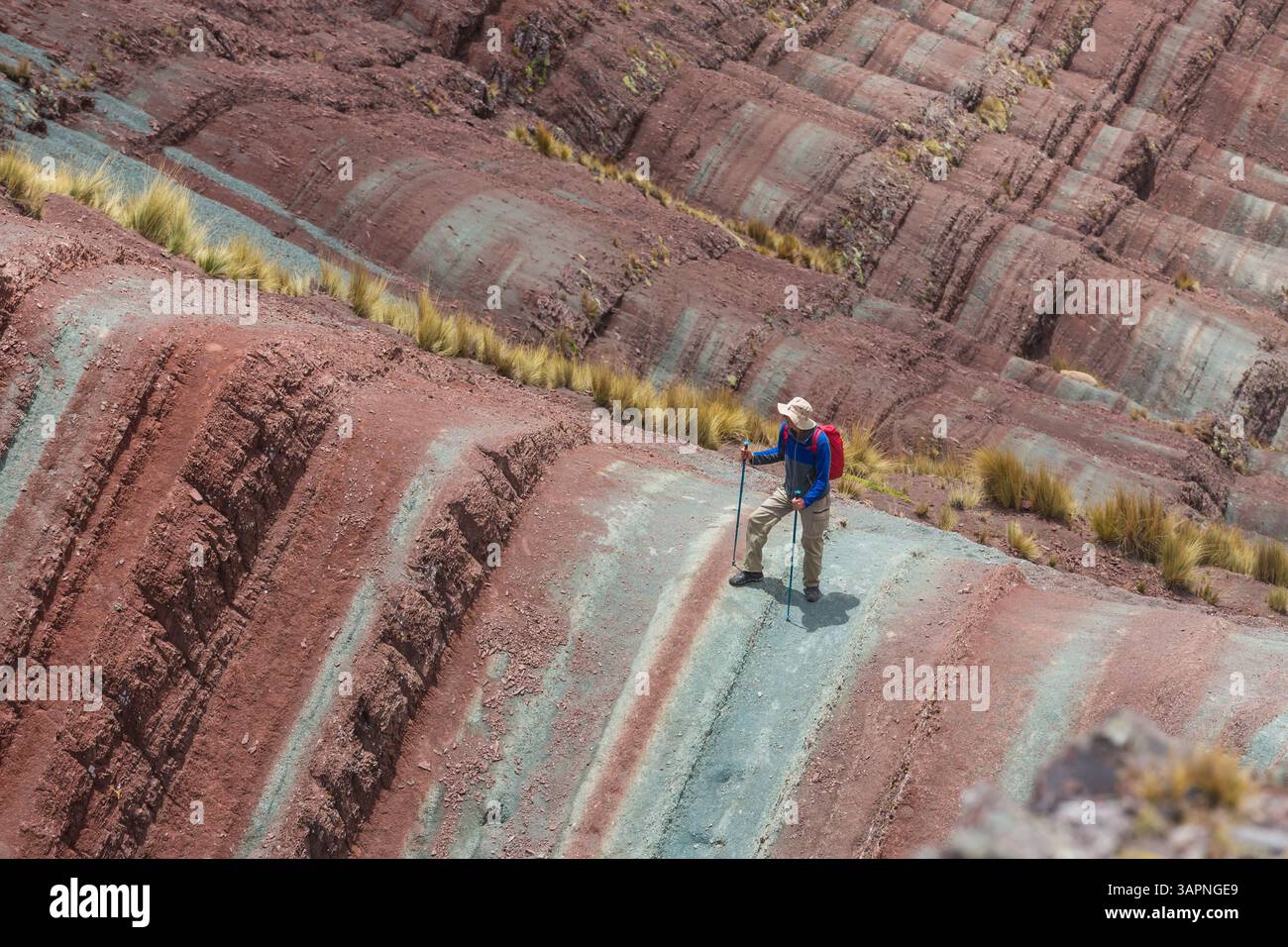 Tourist in surreal Palay Poncho colorful mountains in Peru Stock Photo ...