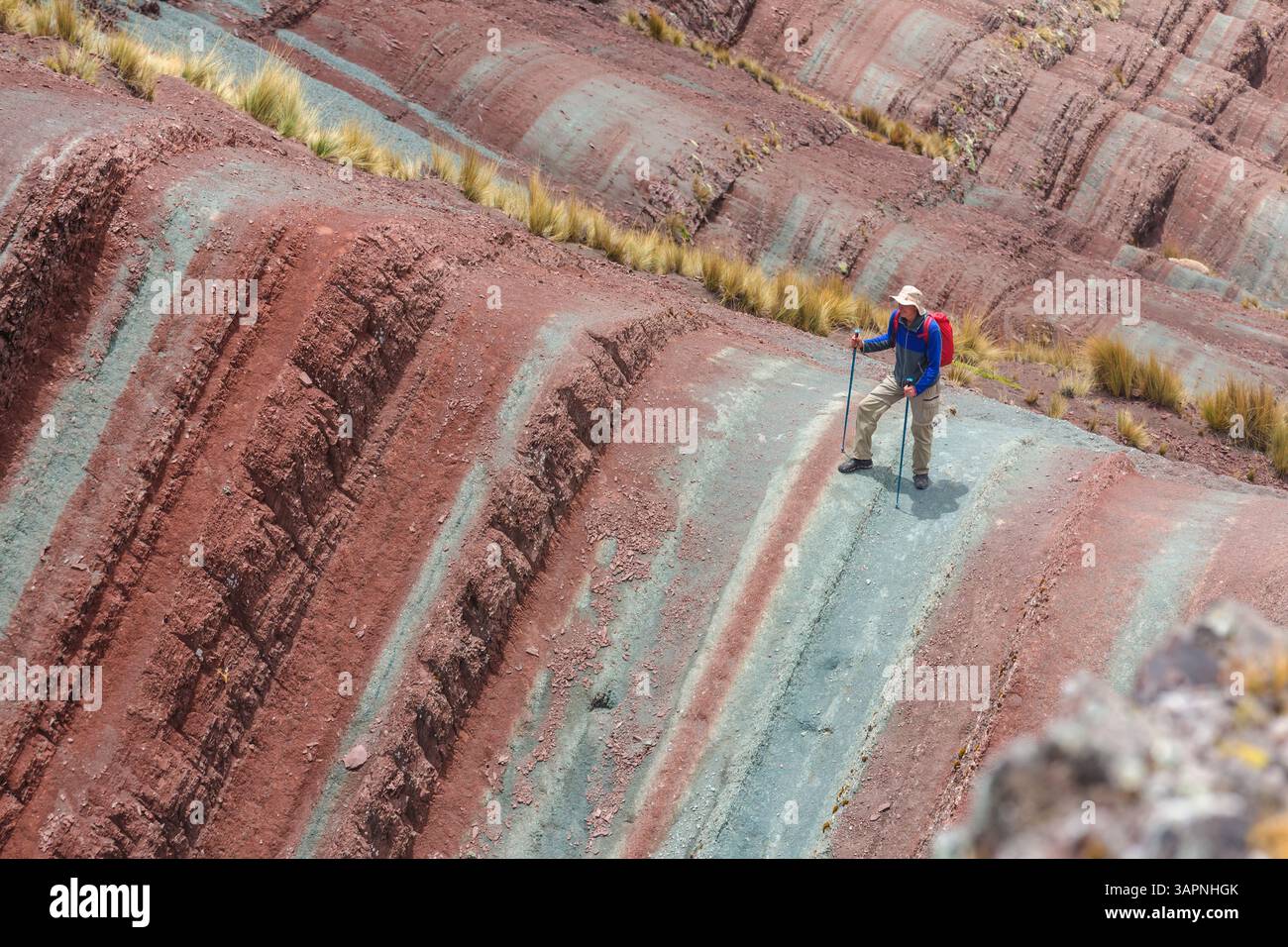 Tourist in surreal Palay Poncho colorful mountains in Peru Stock Photo ...