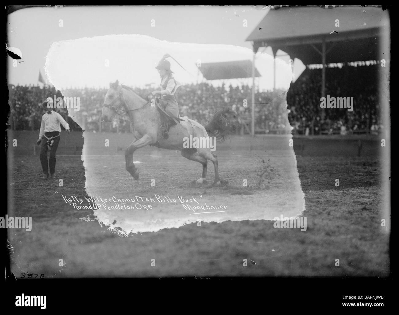 Photograph of Katie Wilkes riding bucking horses Bear Cat and Billy ...