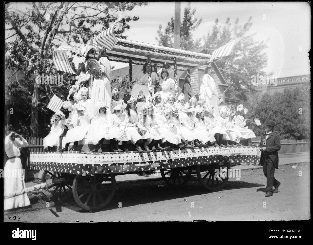 This photograph captures a Fourth of July parade float representing the ...