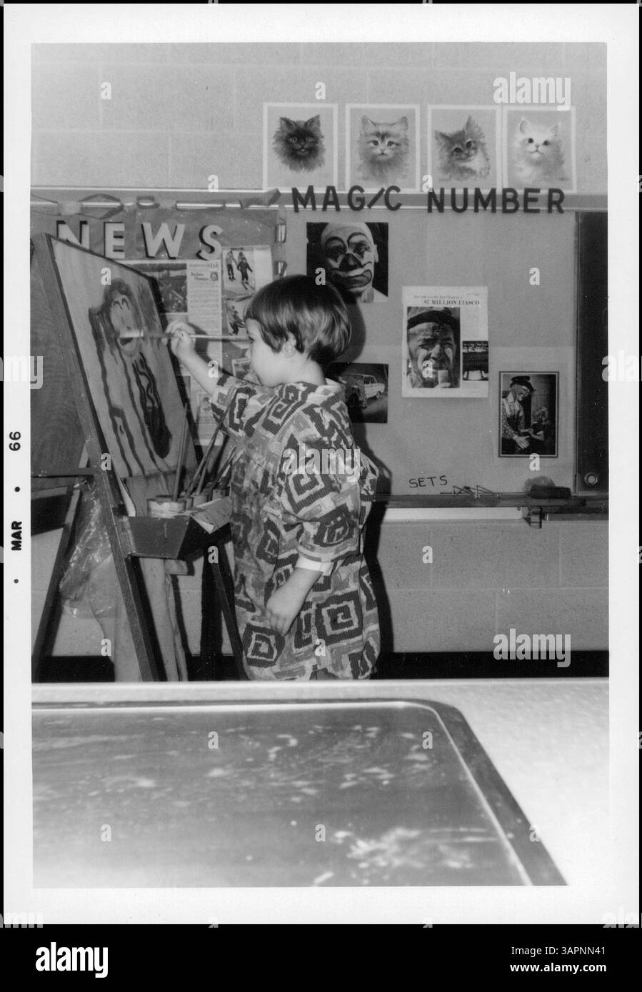 This portrait painting is displayed on an easel, showcasing an interior ...