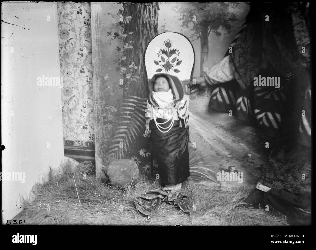 This photograph shows tribal infants in cradles, offering a glimpse ...