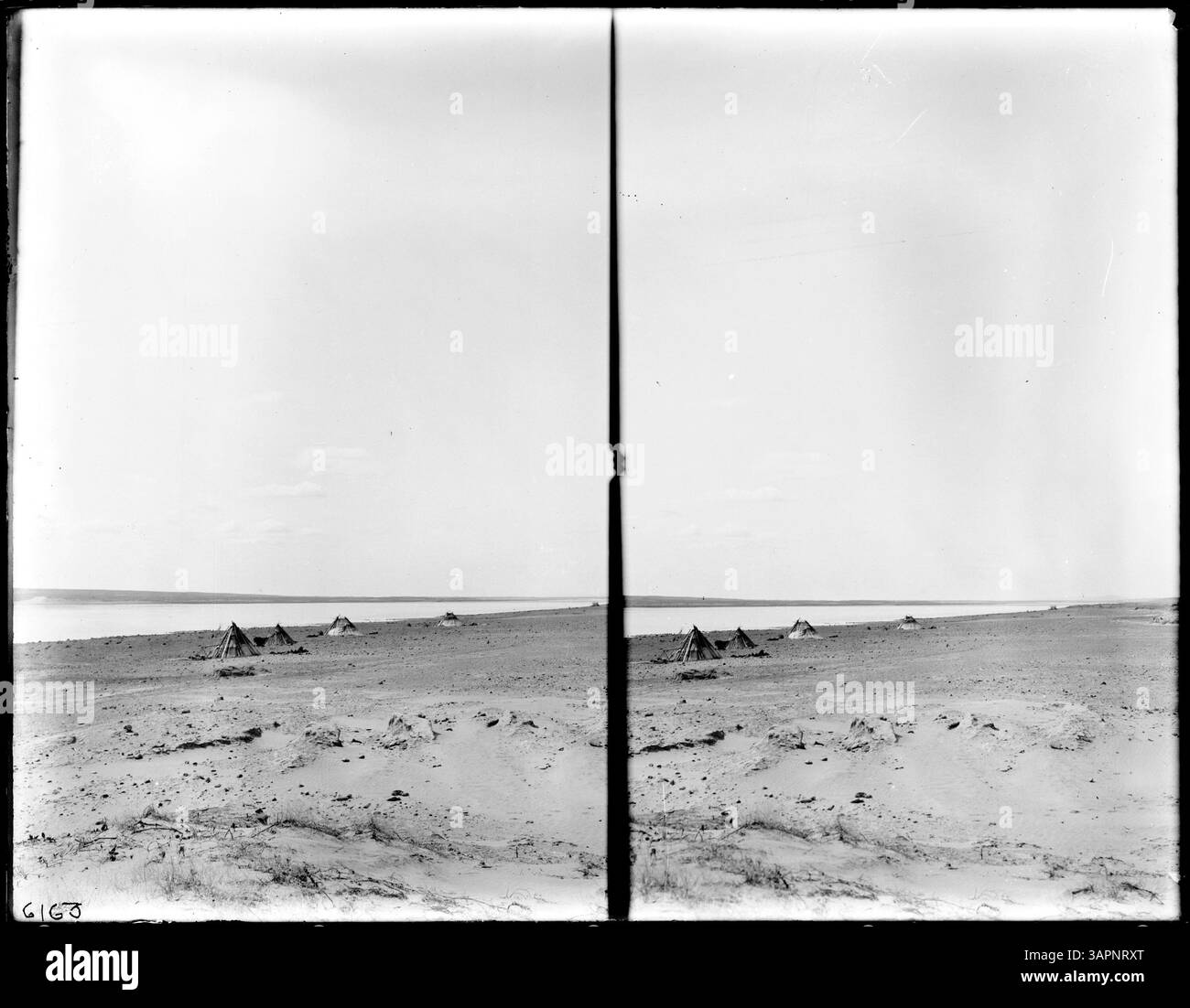 This stereo photograph shows tribal camps along the Columbia River ...