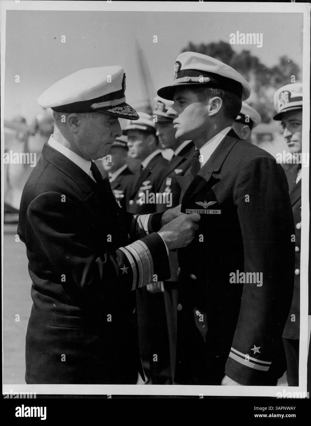 Rear Admiral Montgomery, USN, presents the Distinguished Flying Cross ...