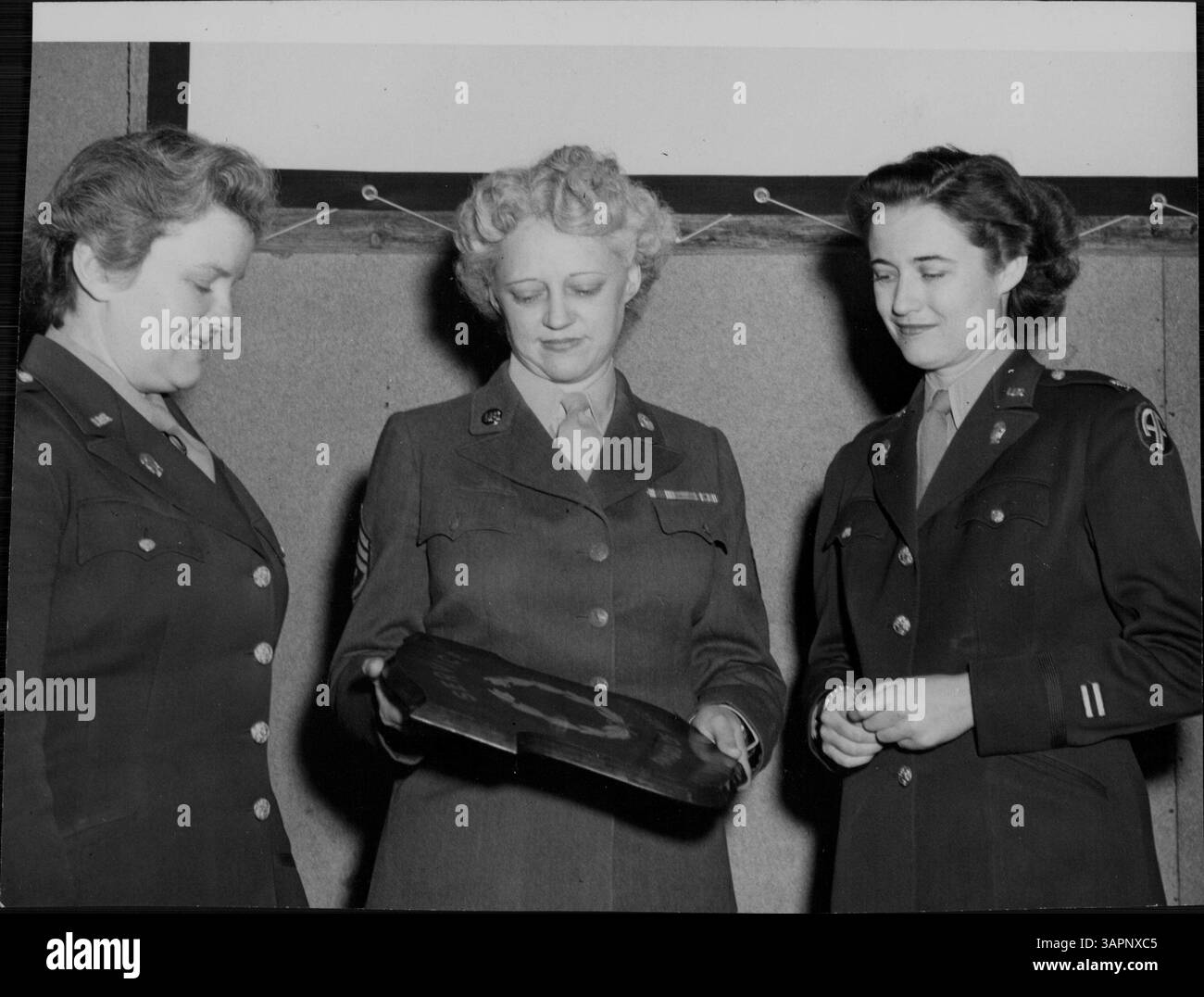 Captain Maxwell of Indianapolis and T/3 Teasly of Hartwell, GA are ...