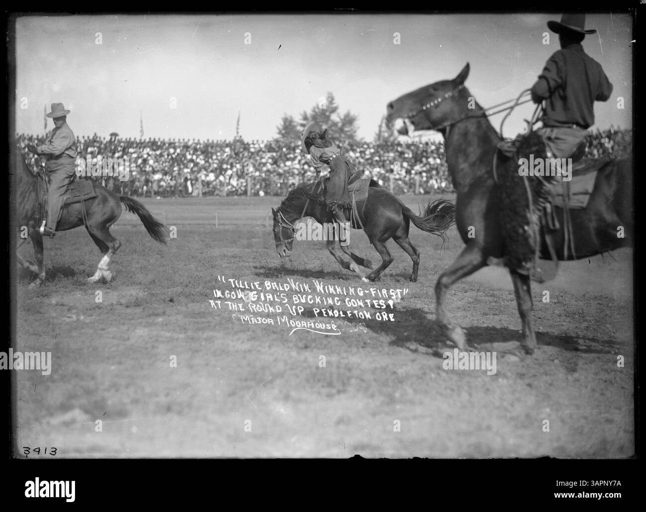 Lee Moorhouse's photograph depicts people on horseback at a rodeo ...