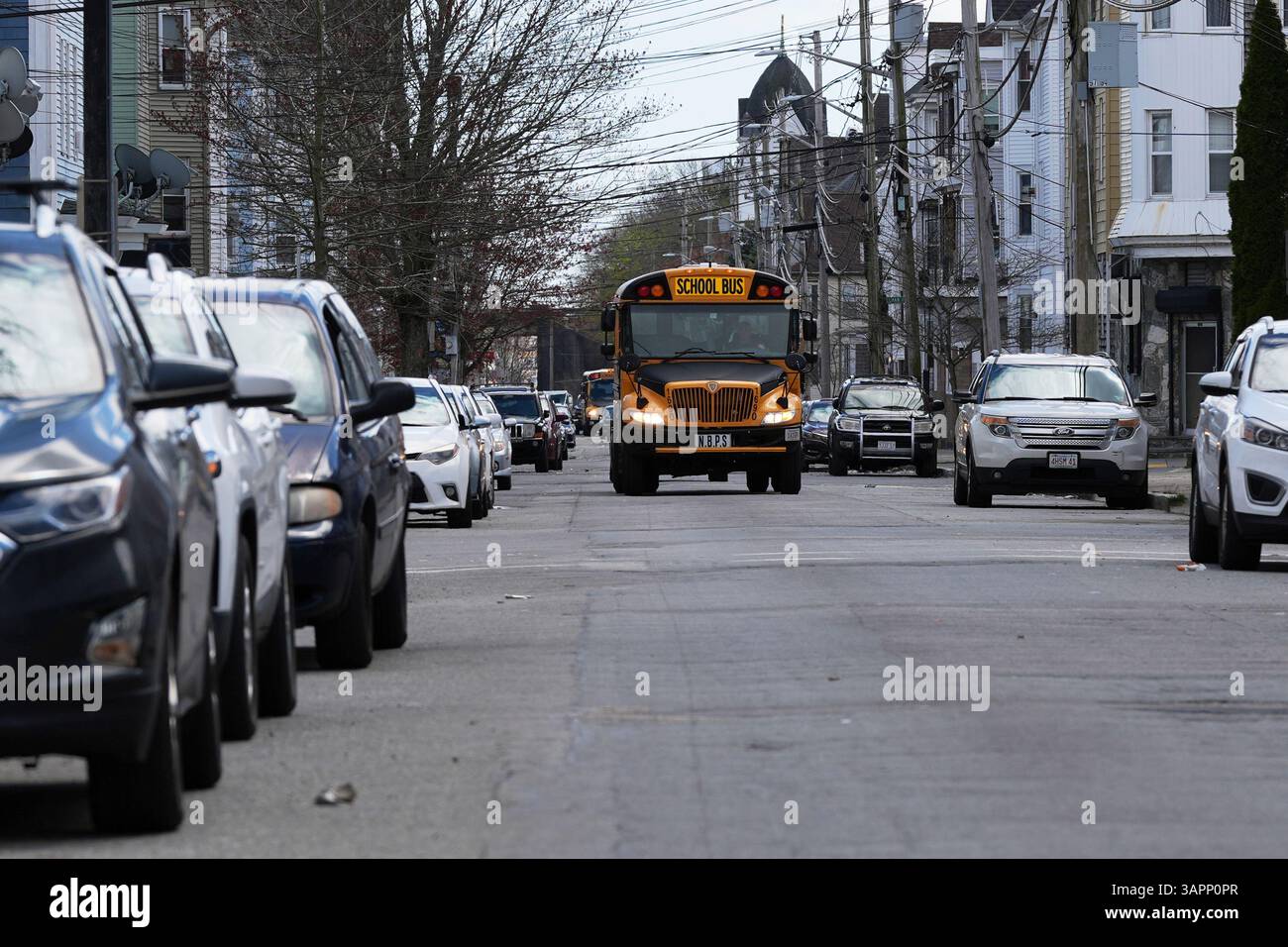 A school bus rolls through a neighborhood near where ICE officers took ...