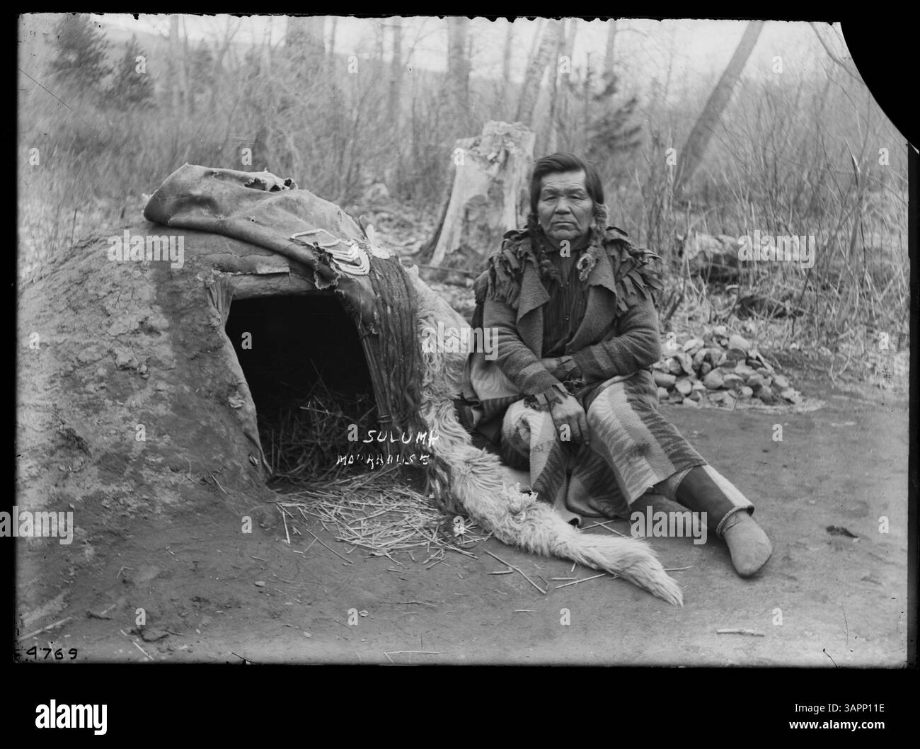 This photograph shows Su-lump, a Cayuse Indian, in regalia, emphasizing ...
