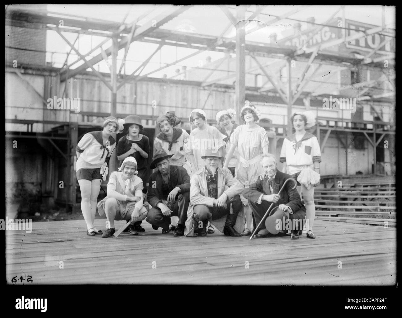 This photograph features actors in costume, captured in single ...
