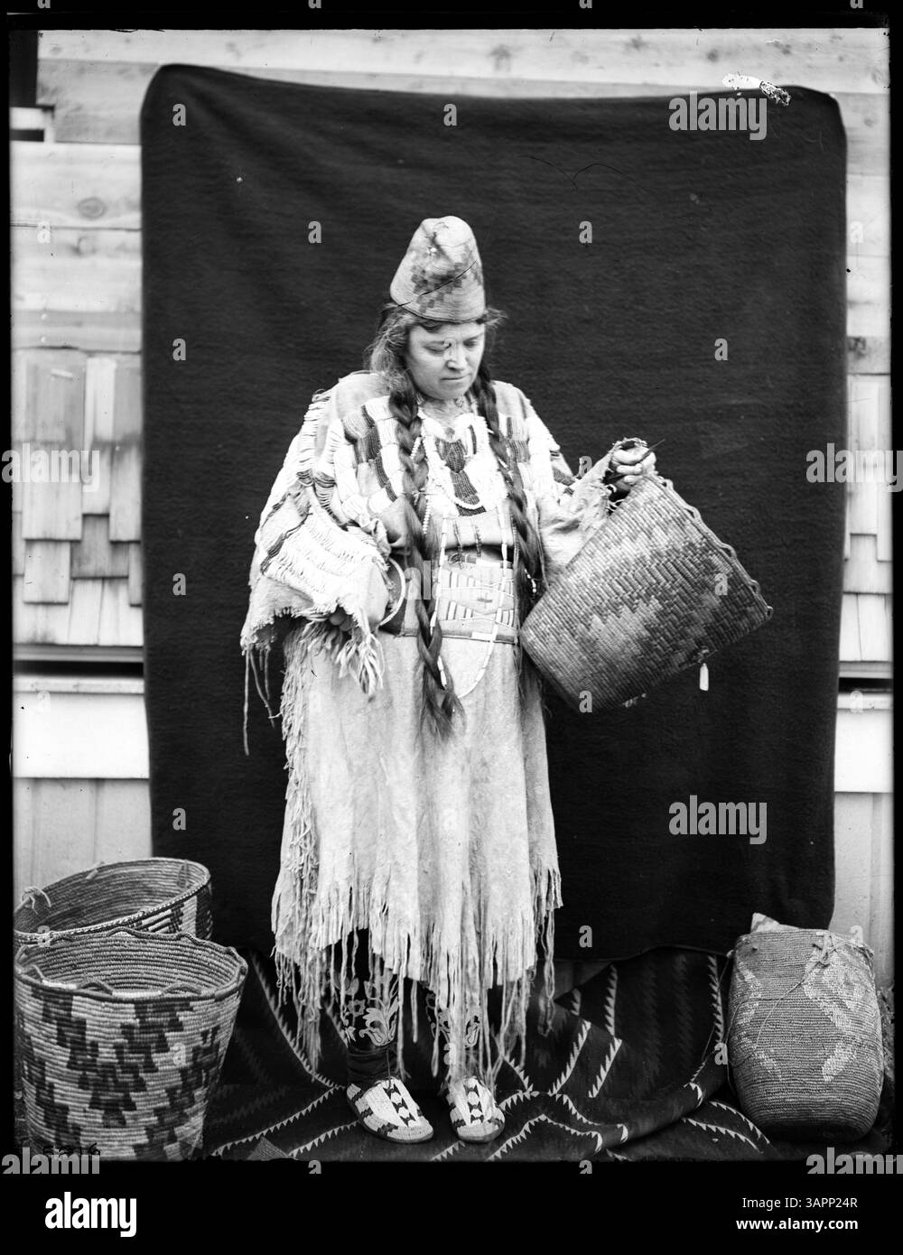 This portrait shows Mrs. Levy Ankeny, a tribal woman, capturing her ...