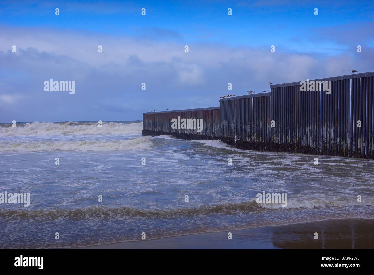 View of the Mexico–U.S. border wall on a rugged Tijuana Pacific beach ...