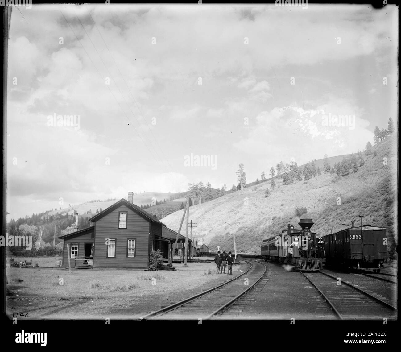 This photograph depicts O.R.N. engine no. 35 with a caboose and two ...
