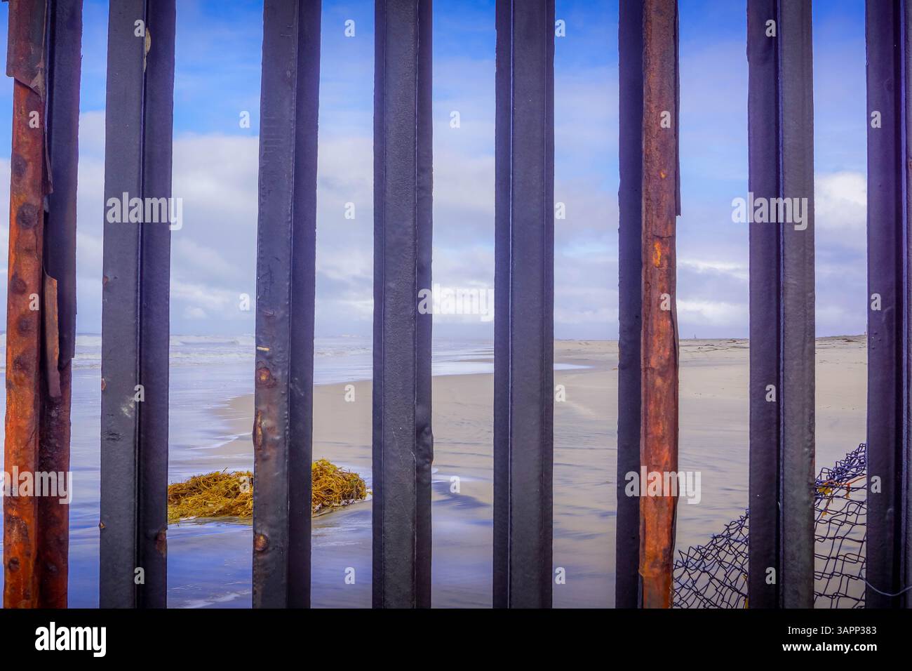 Close-up view through the US-Mexico border wall on Tijuana beach, the ...