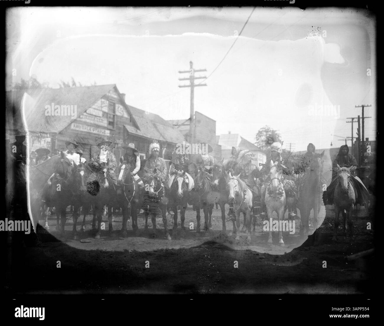 This photograph shows tribal men and cowboys posed on horseback ...