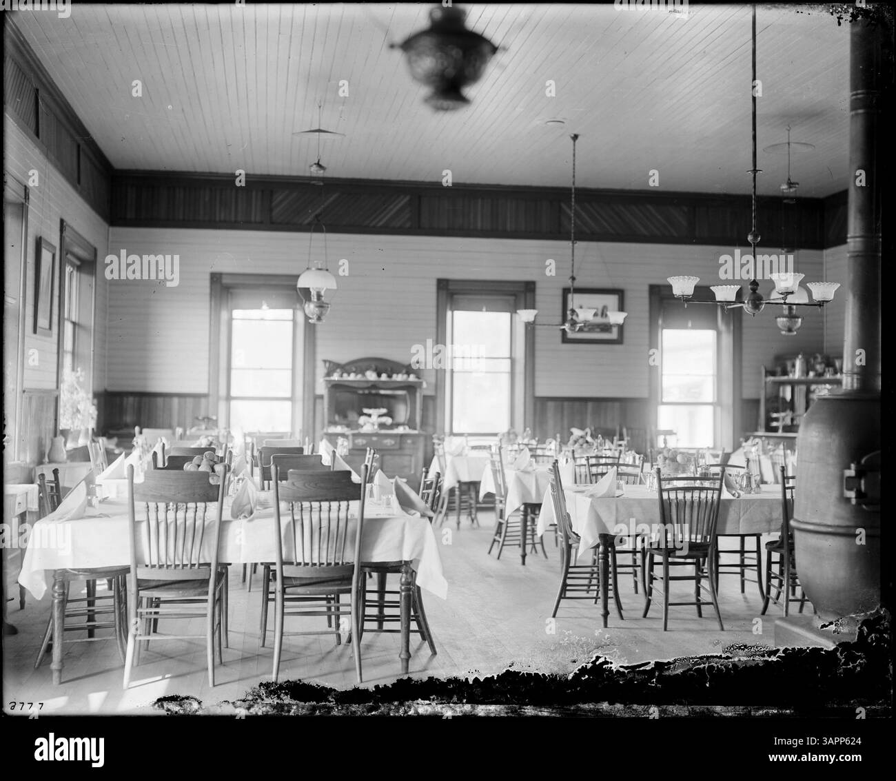 This photograph features the exterior and interior dining room of the ...
