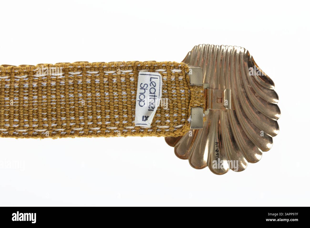 This gold cinch belt with a clamshell buckle belonged to Bonnie Blake ...