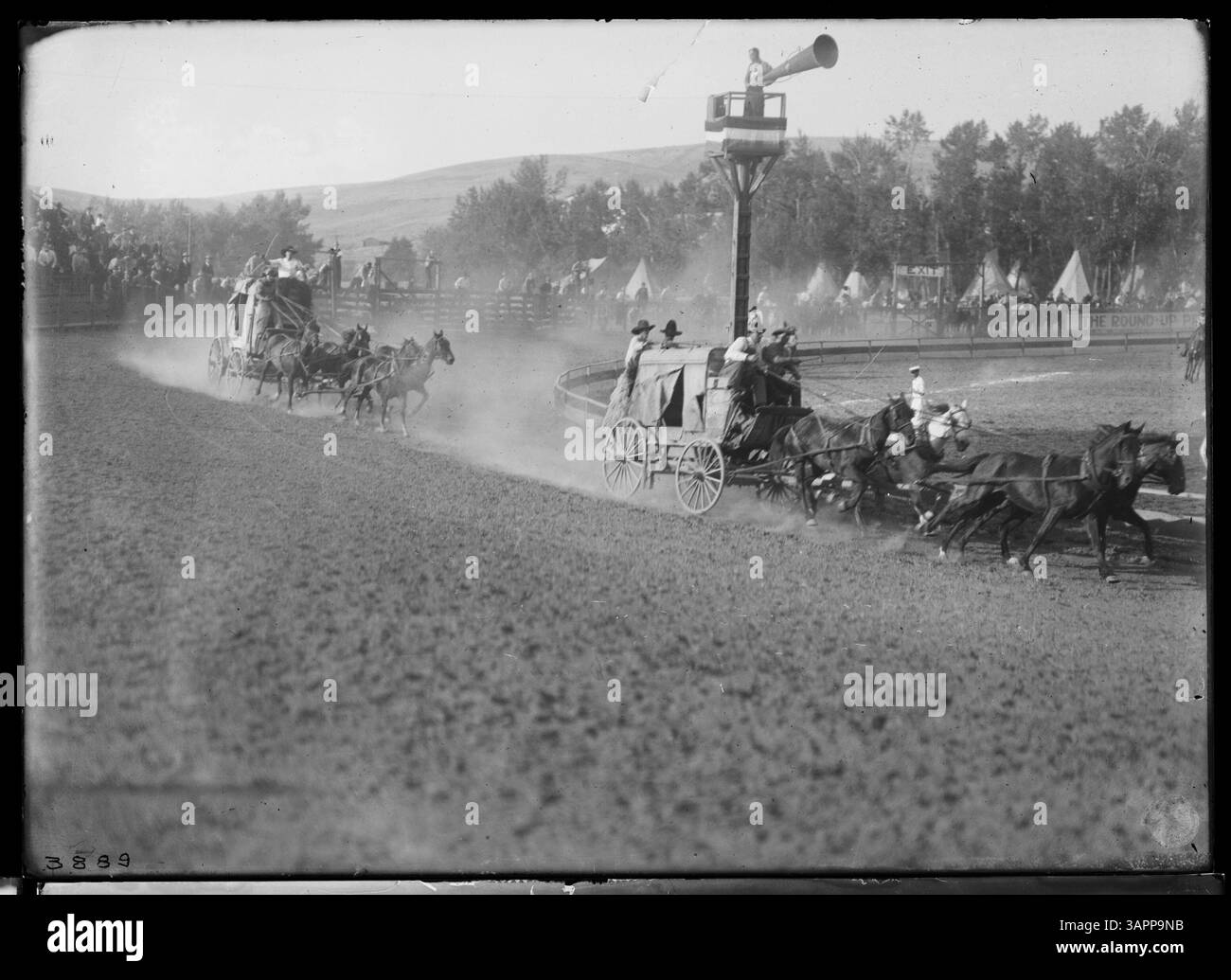 The photograph depicts a stagecoach race, showcasing the speed and ...