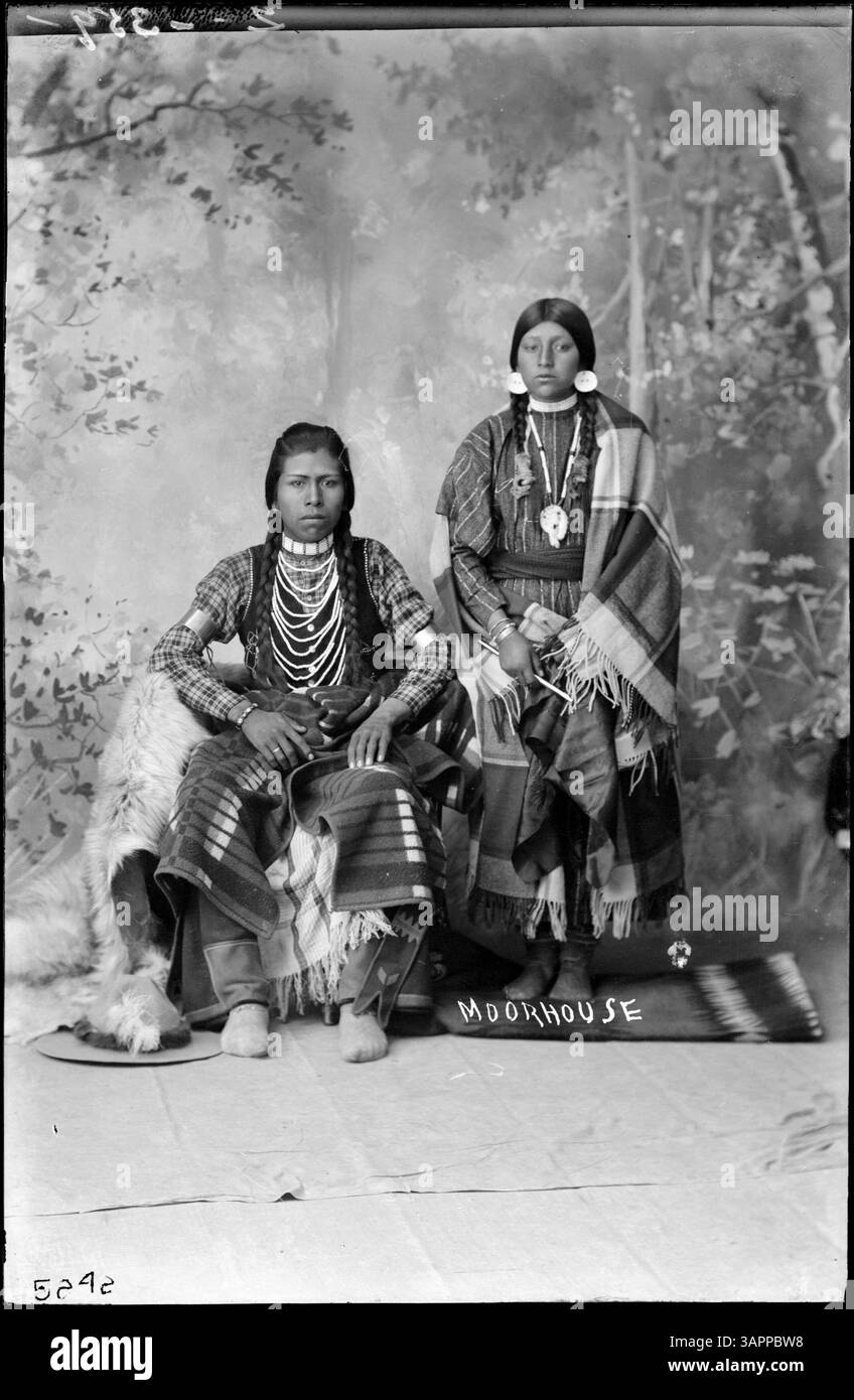 This photograph captures Yakima Indians in regalia, showcasing ...