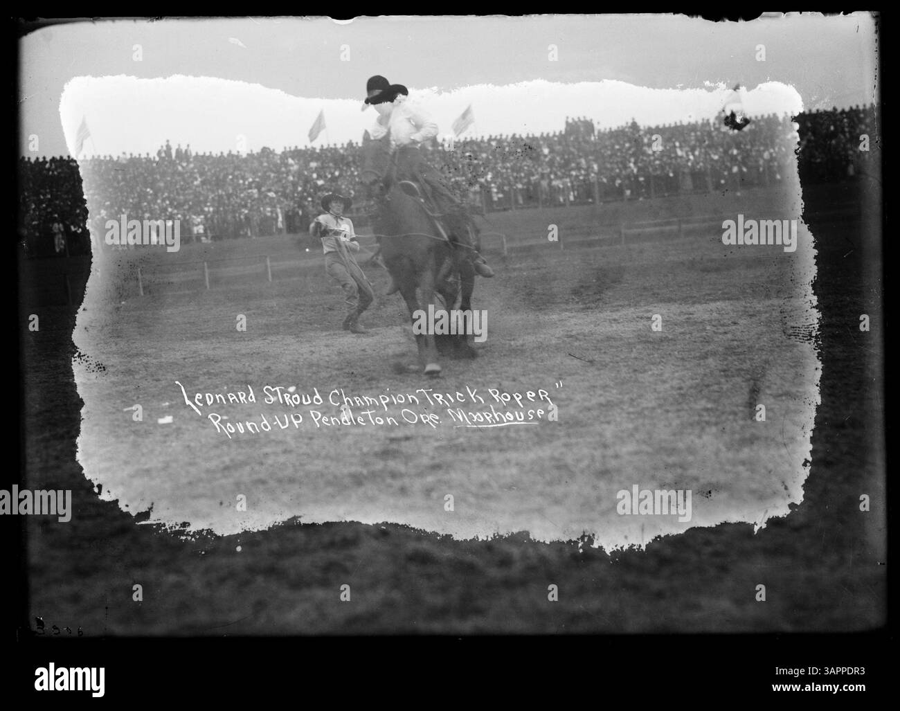 This photograph captures Leonard Stroud performing trick roping ...