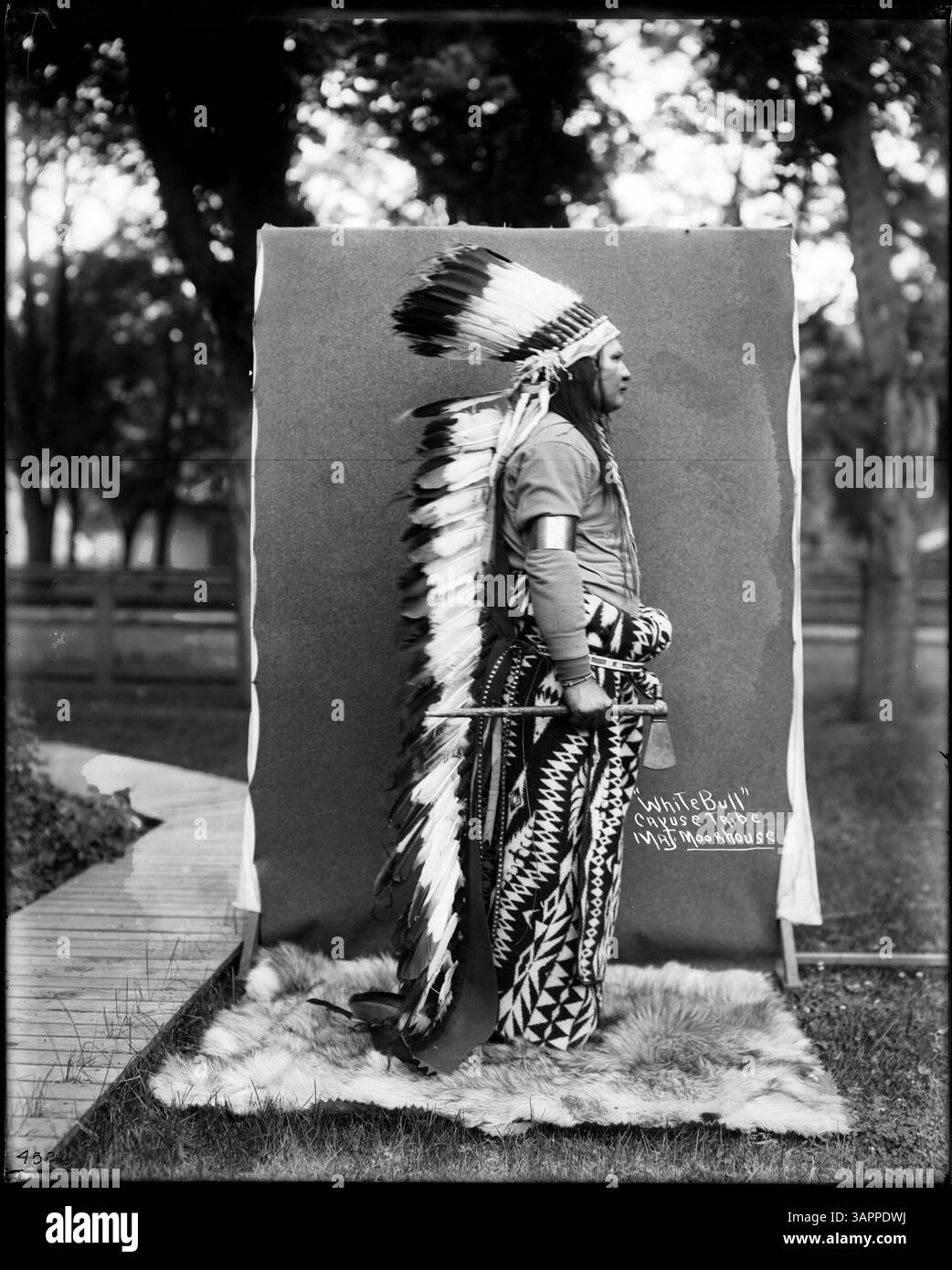 This image by Lee Moorhouse shows White Bull, a Cayuse man, dressed in ...