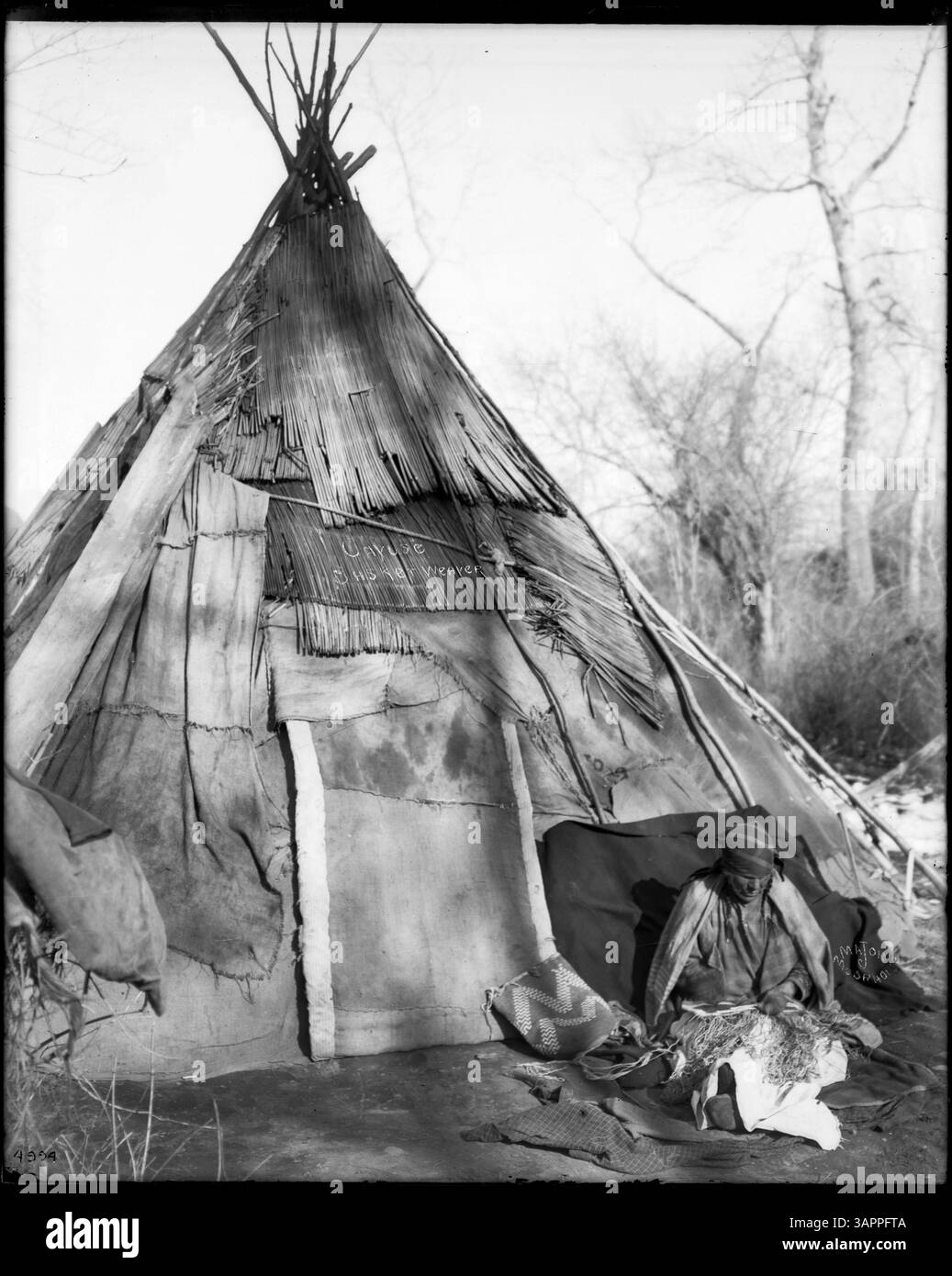 Lee Moorhouse captured Jemima, a Cayuse woman, outside a tipi weaving a ...