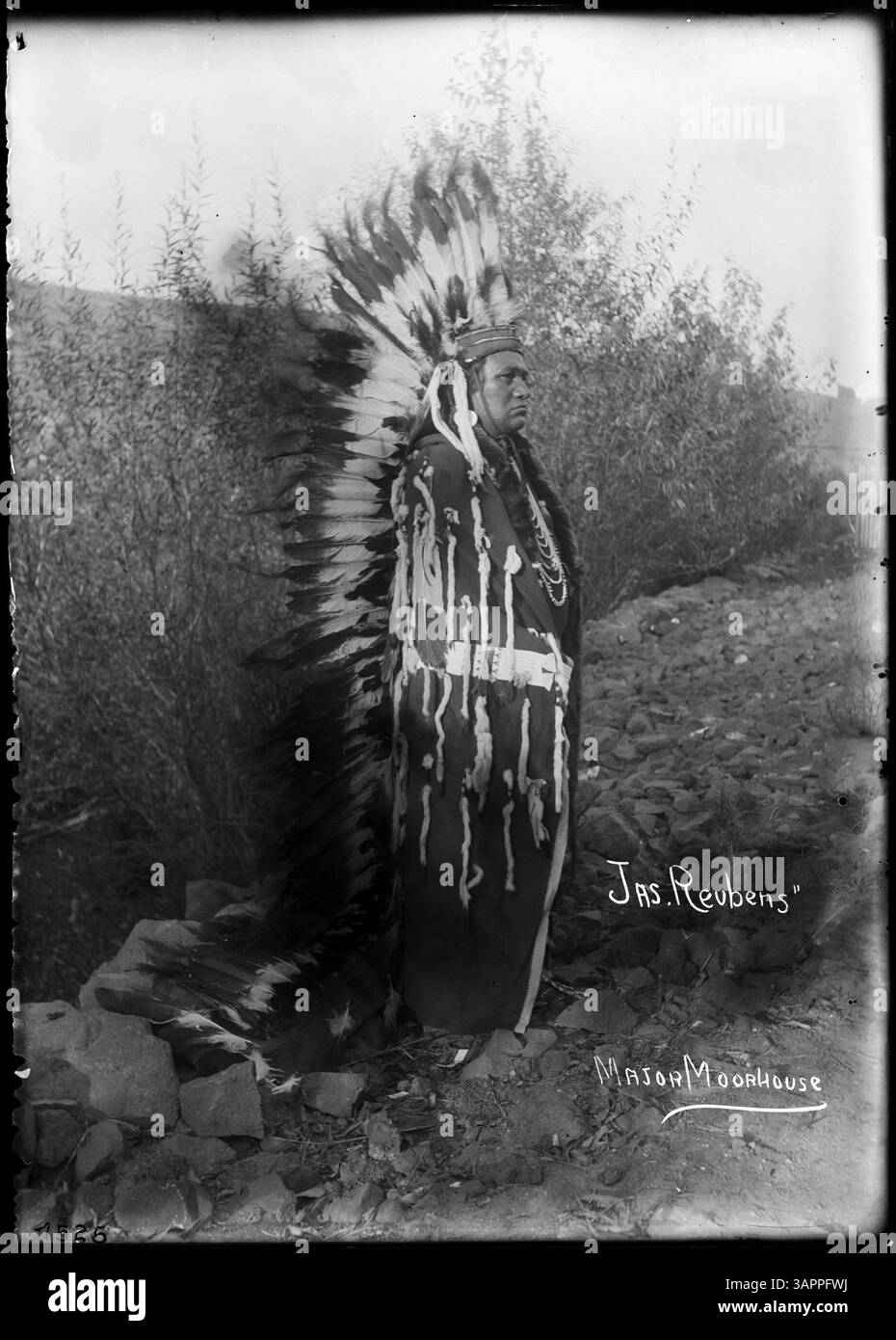 James Reubens, a Nez Perce man, is photographed in full regalia with a ...
