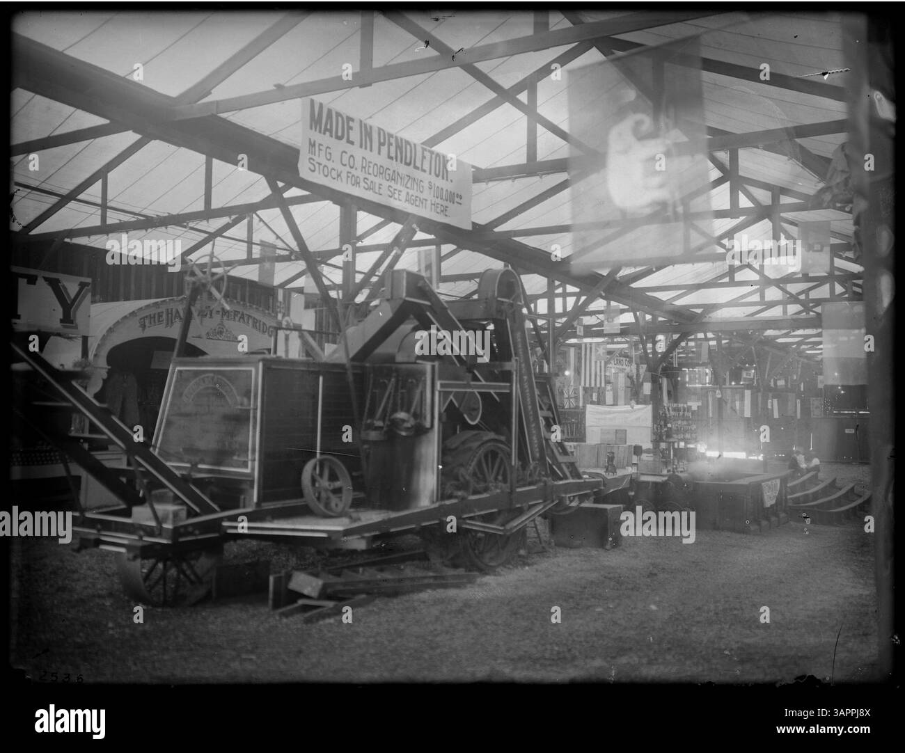 This photograph shows a county fair in Pendleton, including exhibits ...